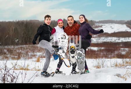 family hiking with snowshoes racket in winter day Stock Photo - Alamy