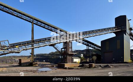 Conveyor belts with stone crushing and sorting buildings in a stone ...