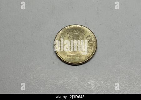 closeup of vintage 5 or five rupee gold coins of india arranged in a ...