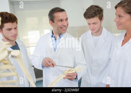 Doctor hand pointing to skeleton fingers with red point. Joints ...