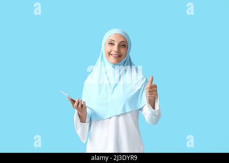 Portrait of Muslim secretary showing thumb-up on white background Stock ...