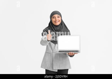 Portrait of Muslim secretary showing thumb-up on white background Stock ...