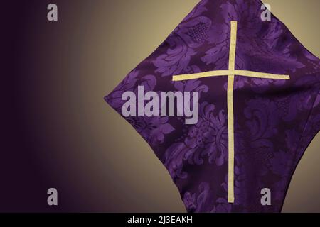 Holy Week. Cross covered with purple fabric in the period of lent ...