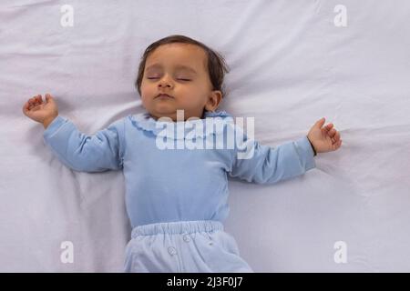 Little baby sleeping on bed Stock Photo - Alamy