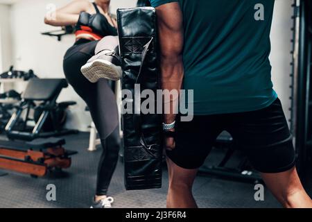 Dedicated to fitness. an unrecognizable athletic man working out with ...