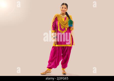 Portrait of happy Sikh woman posing in front of camera Stock Photo - Alamy