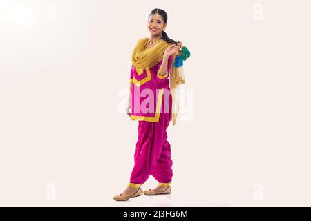 Portrait of a happy Sikh woman posing in front of camera Stock Photo ...