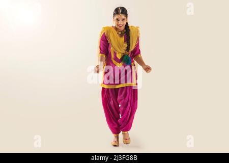 Sikh Woman performing bhangra during Baisakhi Celebration Stock Photo ...