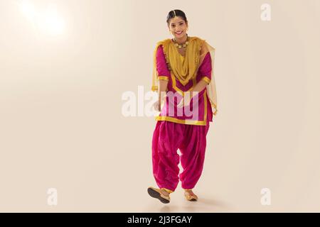 Sikh Woman performing bhangra during Baisakhi Celebration Stock Photo ...