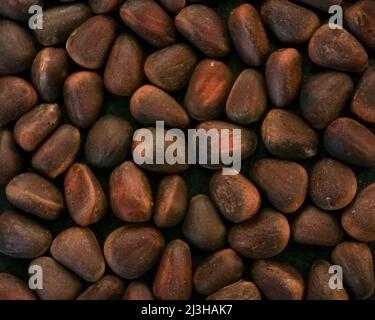 close-up of fresh peeled pine nuts isolated on a white background Stock ...