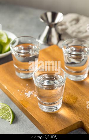 Boozy Refreshing Tequila Shots with Lime and Salt Stock Photo - Alamy
