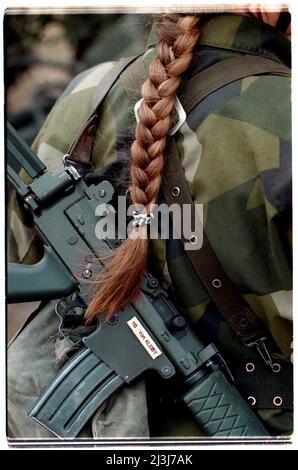 A female conscript Swedish soldier in the Swedish army during a ...
