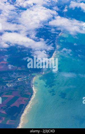Aerial view of French coastline and Calais seen from a flying plain ...
