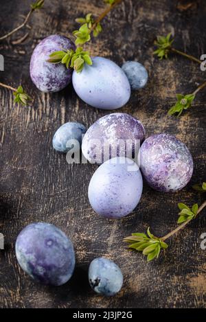 Festive Easter eggs in purple and blue color Stock Photo - Alamy