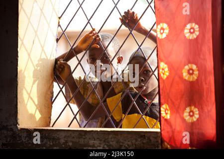 Two children peer through the windows at a tea-dance in the Octagon ...