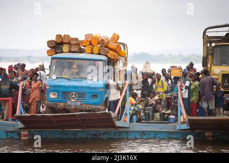 An overloaded ferry crosses the Congo River at Luozi.; Luozi ...