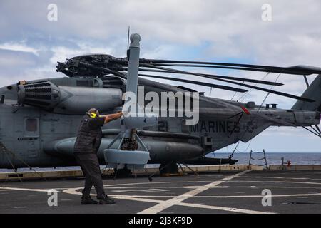 Dale Thompson, a contractor with Martin UAV, assists the launch of a ...