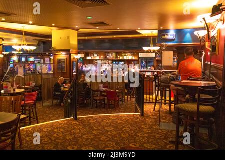 Traditional interior view of Wetherspoon The Eight Bells pub at Cannon ...