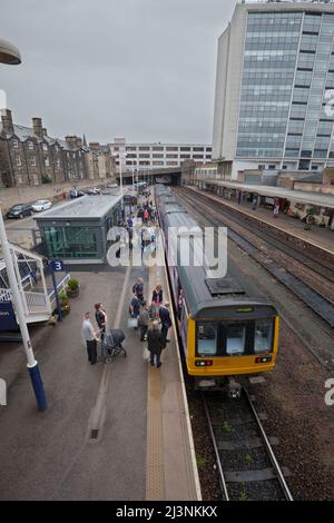 Passengers boarding a Northern Rail class 158 passenger train at Brough ...