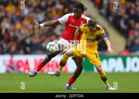 Joshua Kayode of Rotherham United and Harry Beautyman of Sutton United ...