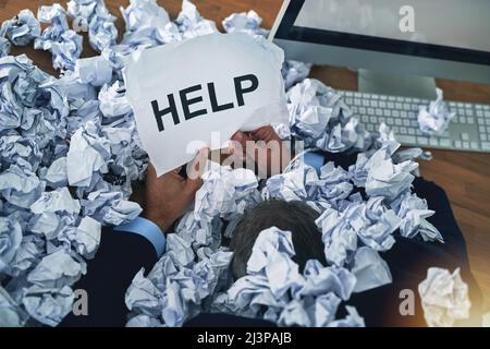 Admin can get the better of anyone. Shot of an unidentifiable ...