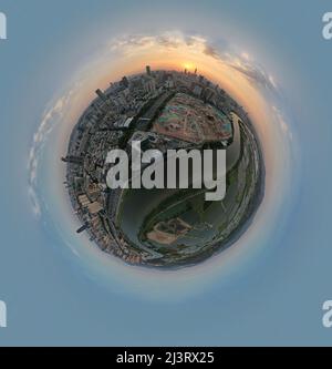 Aerial view of a tiny planet scene featuring a roundabout surrounded by ...