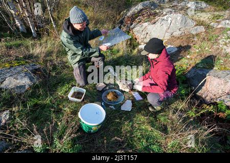 Two insect researchers at Örö island, Kemiönsaari, Finland Stock Photo ...