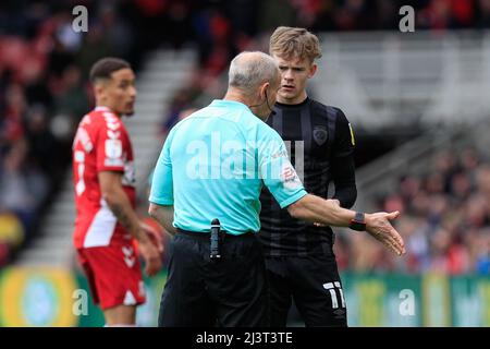 Referee Andy Woolmer speaks with Keane Lewis-Potter #11 of Hull City ...
