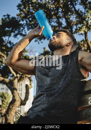 Low angle shot of man water skiing at sunset . Man wakeboarding on a ...