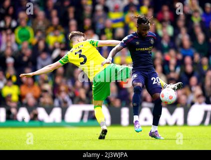 Norwich City's Sam Byram (left) and Manchester City's Rodrigo battle ...