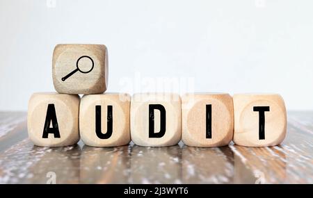 Letter block in word audit on yellow-blue background Stock Photo - Alamy