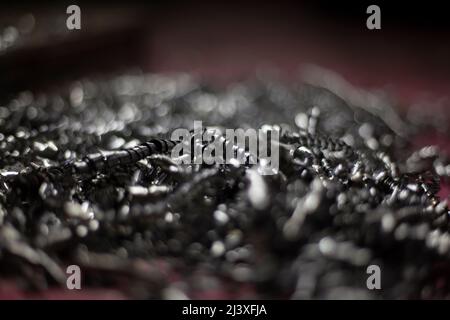 Metal shavings. Production waste. Steel chips after drilling. Garbage ...