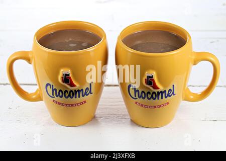 pair of Chocomel mugs with chocolate-flavoured milk isolated on white ...