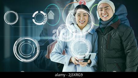 Multiple round scanners over portrait of caucasian family smiling ...