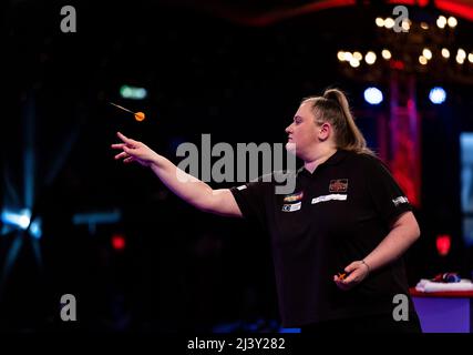 Beau Greaves in action during her match against Michael van Gerwen at ...
