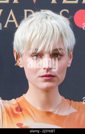 Emma Corrin attends the Olivier Awards 2022 at the Royal Albert Hall in ...