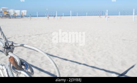 Lifeguard hut and volleyball court on beach under clear sky, Manhattan ...