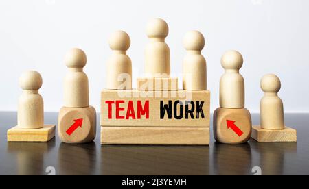 TEAMWORK word written on wood block. TEAMWORK text on wooden table for ...