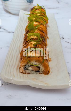 Salmon Sushi Rolls Platted On A White Marble Table. Image can be ...