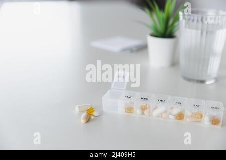 white tablet medicine arranging on yellow background Stock Photo - Alamy