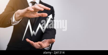 Businessman hold drawing on screen growing graph, arrow of positive ...