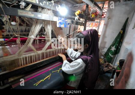 Workers manufacture Chanderi Silk and Cotton Sarees by weaving in ...