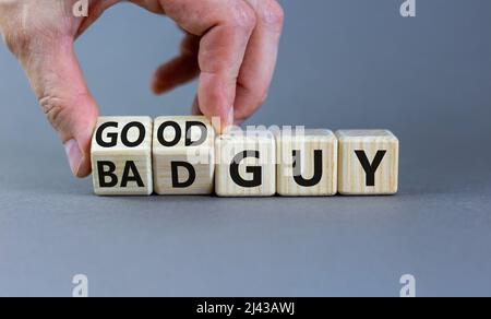 Good or bad guy symbol. Businessman turns cubes and changes concept ...