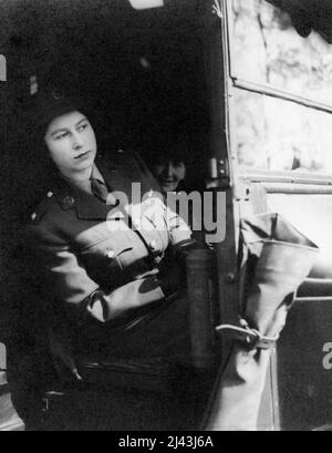 Princess Elizabeth seated at the driving wheel of an ambulance in April ...