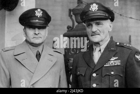 Lt. General Carl A. Spaatz and his staff stand at attention while a ...