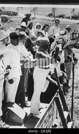 Italian dictator Benito Mussolini, stripped to the waist, with right ...