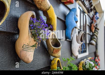Traditional wooden clogs as a planter and decoration Stock Photo - Alamy