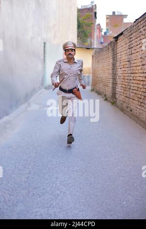 Police cap, gun and baton on white background, closeup Stock Photo - Alamy
