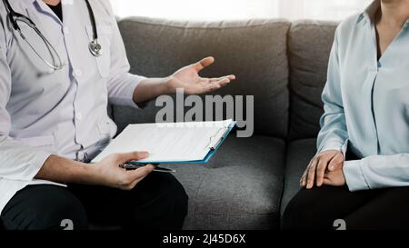 Doctor visited the patient while wearing a mask at home to check the ...