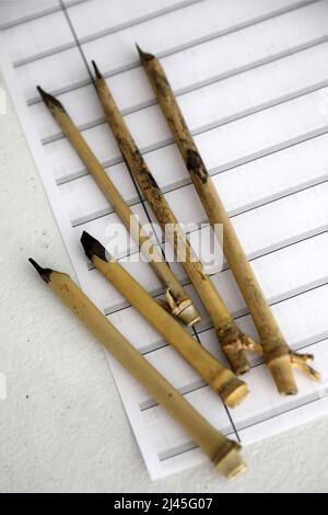 Writing exercise, calligraphy. Reed pen in back ink and handwriting ...